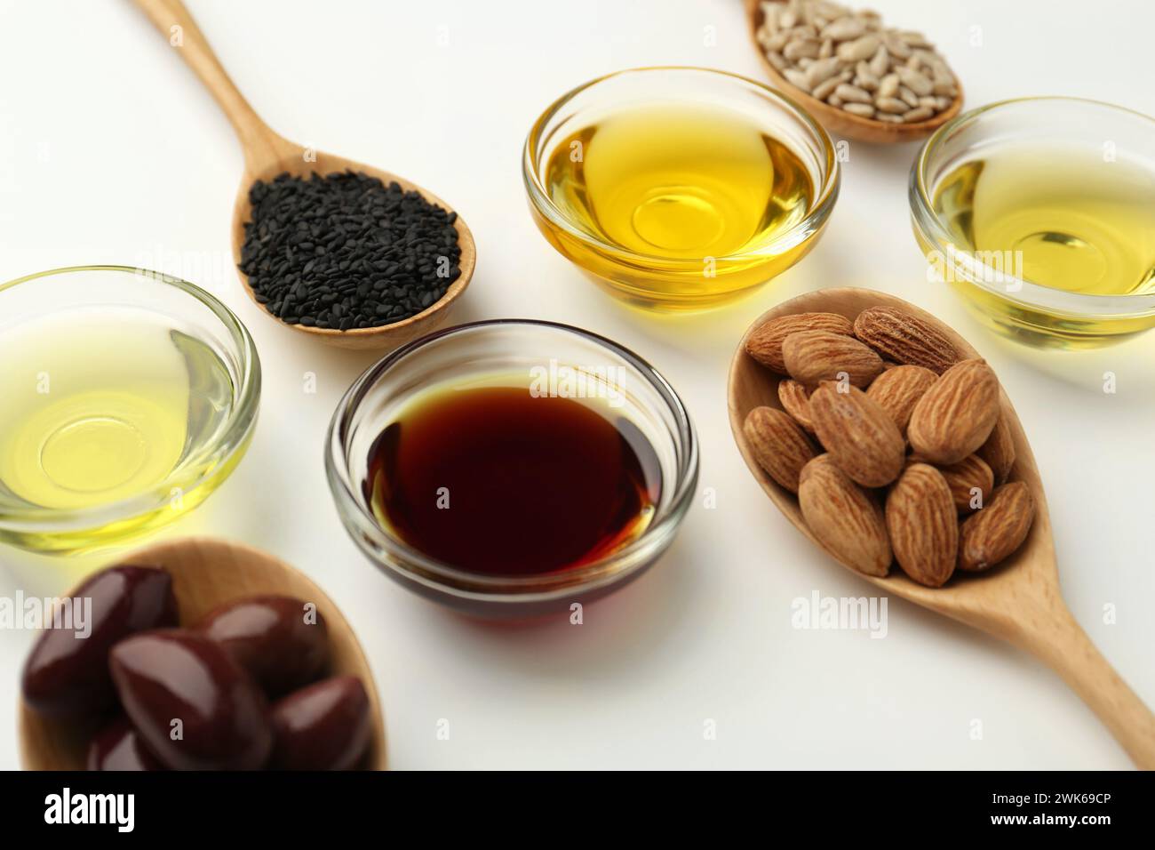 Vegetable fats. Different cooking oils in bowls and spoons with ...