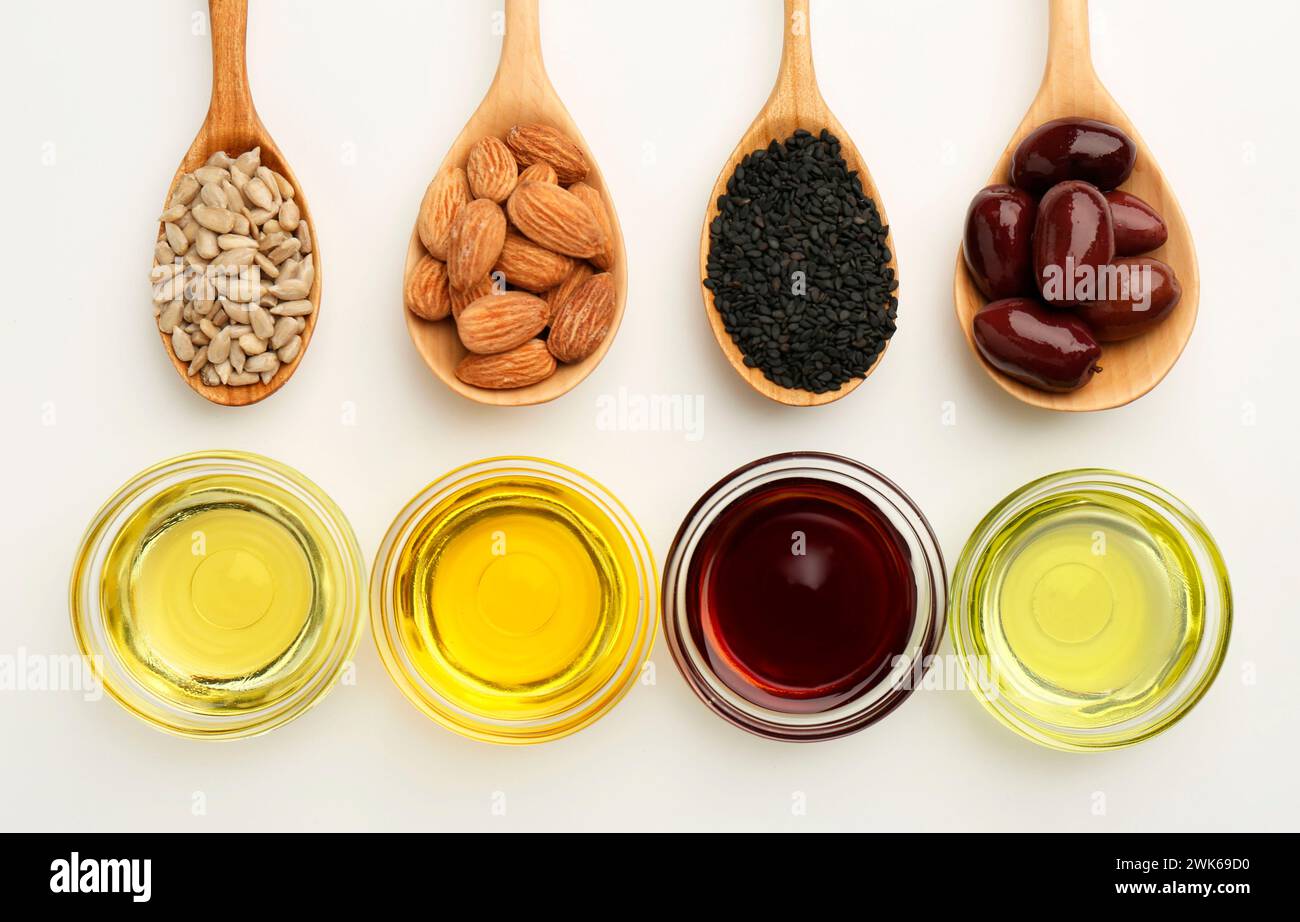 Vegetable fats. Different cooking oils in bowls and spoons with ...