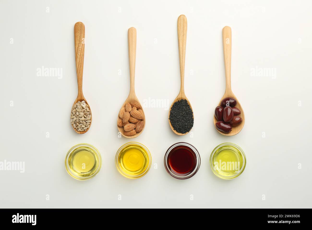Vegetable fats. Different cooking oils in bowls and spoons with ...