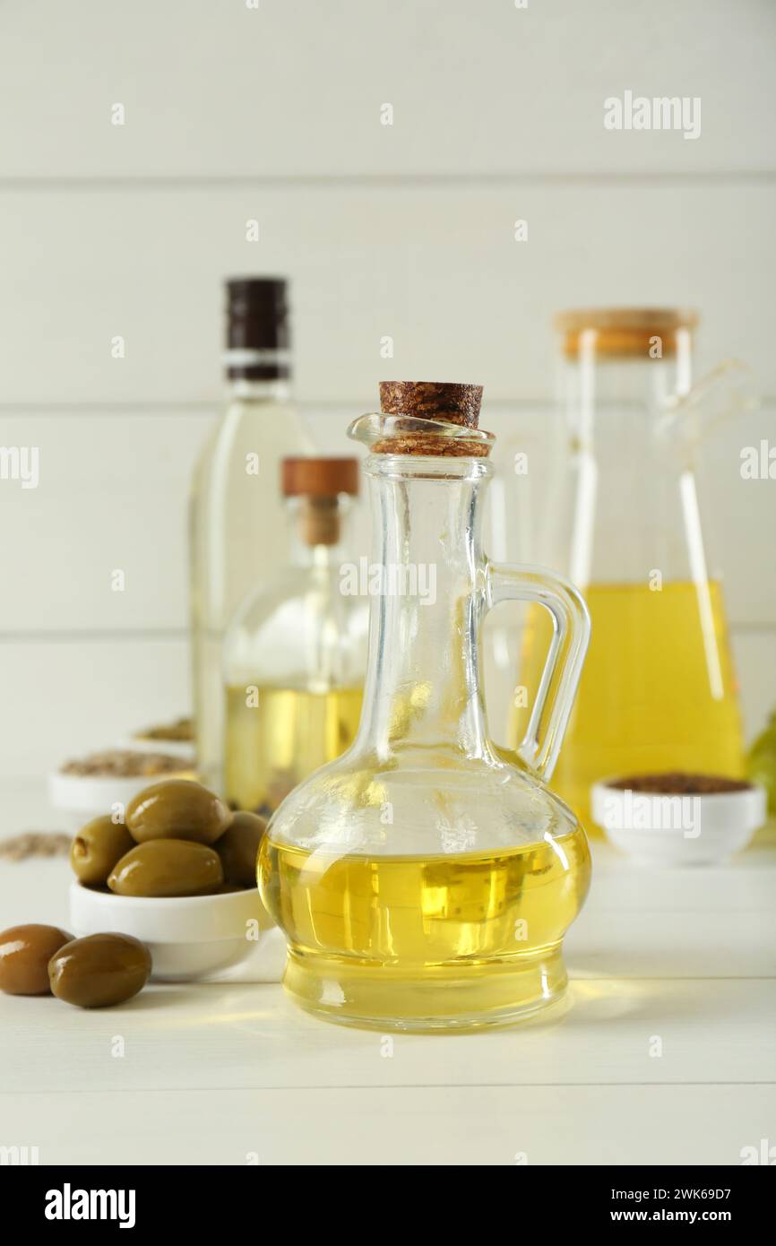 Vegetable fats. Different cooking oils in bottles and ingredients on ...