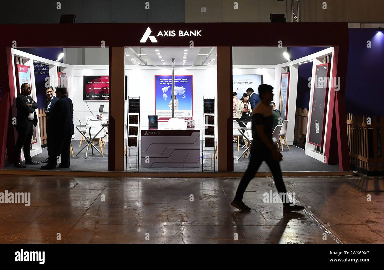 Mumbai, India. 18th Feb, 2024. A man seen walking past Axis bank logo ...
