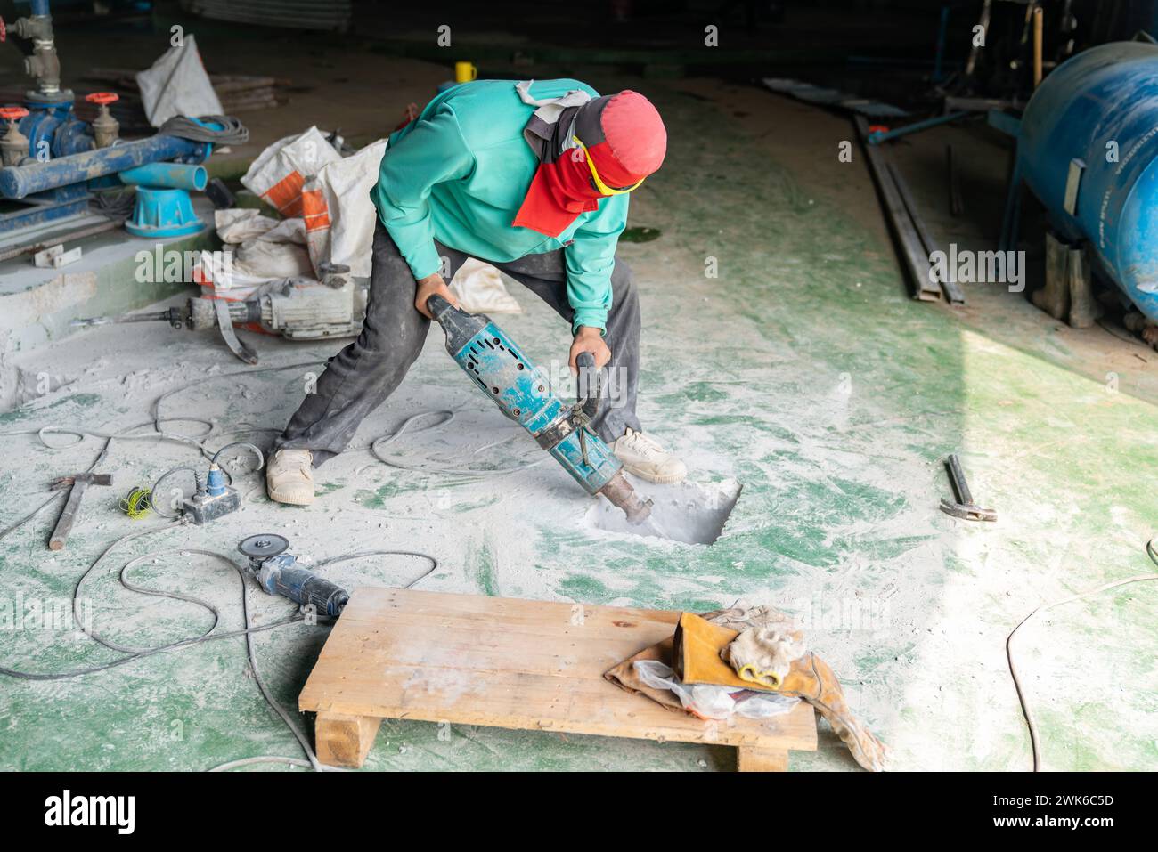 Worker use jack hammer drill concrete hold for install foundation in ...