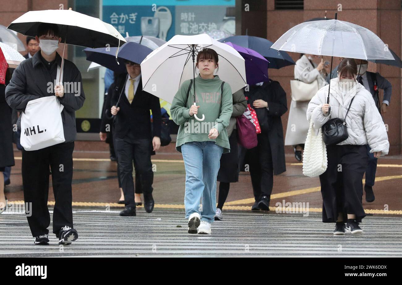 People commute to work while raining in Fukuoka City, Fukuoka ...