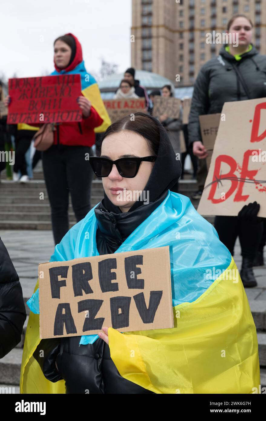 A protester holds a placard during the rally. On Sunday, the ...