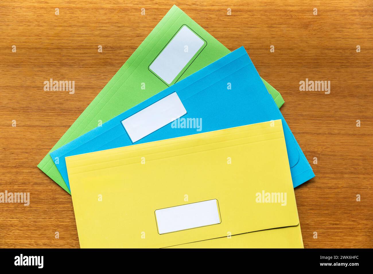 Collection of colorful Manila folders arranged in a timber desk Stock ...