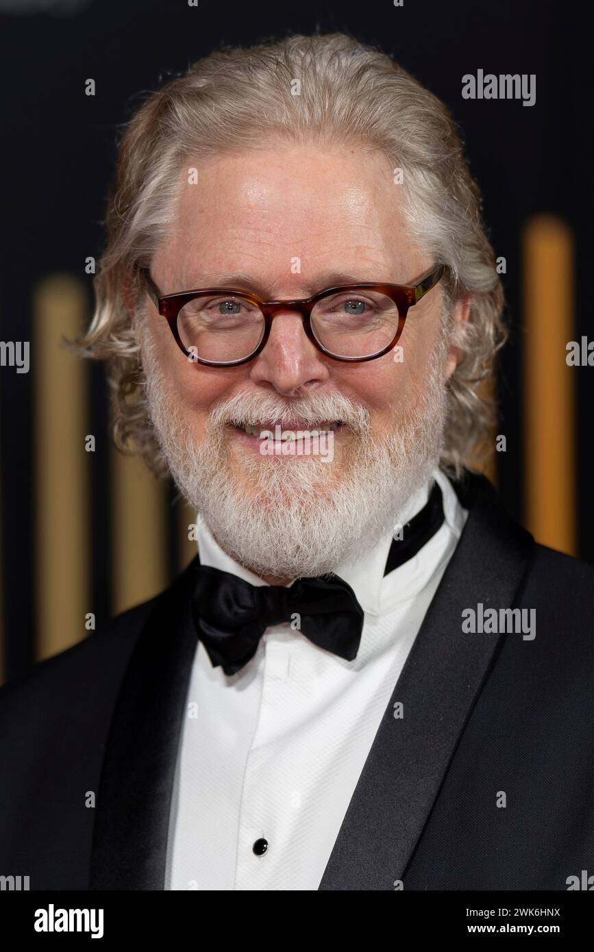 Writer Tony McNamara poses for photographers upon arrival at the 77th ...