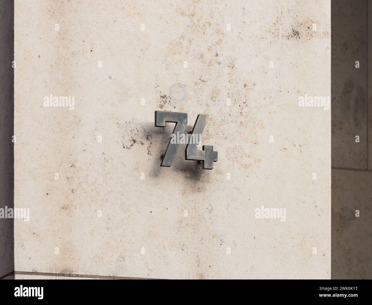 Number 74 on an exterior house wall. The seventy-four is part of an ...