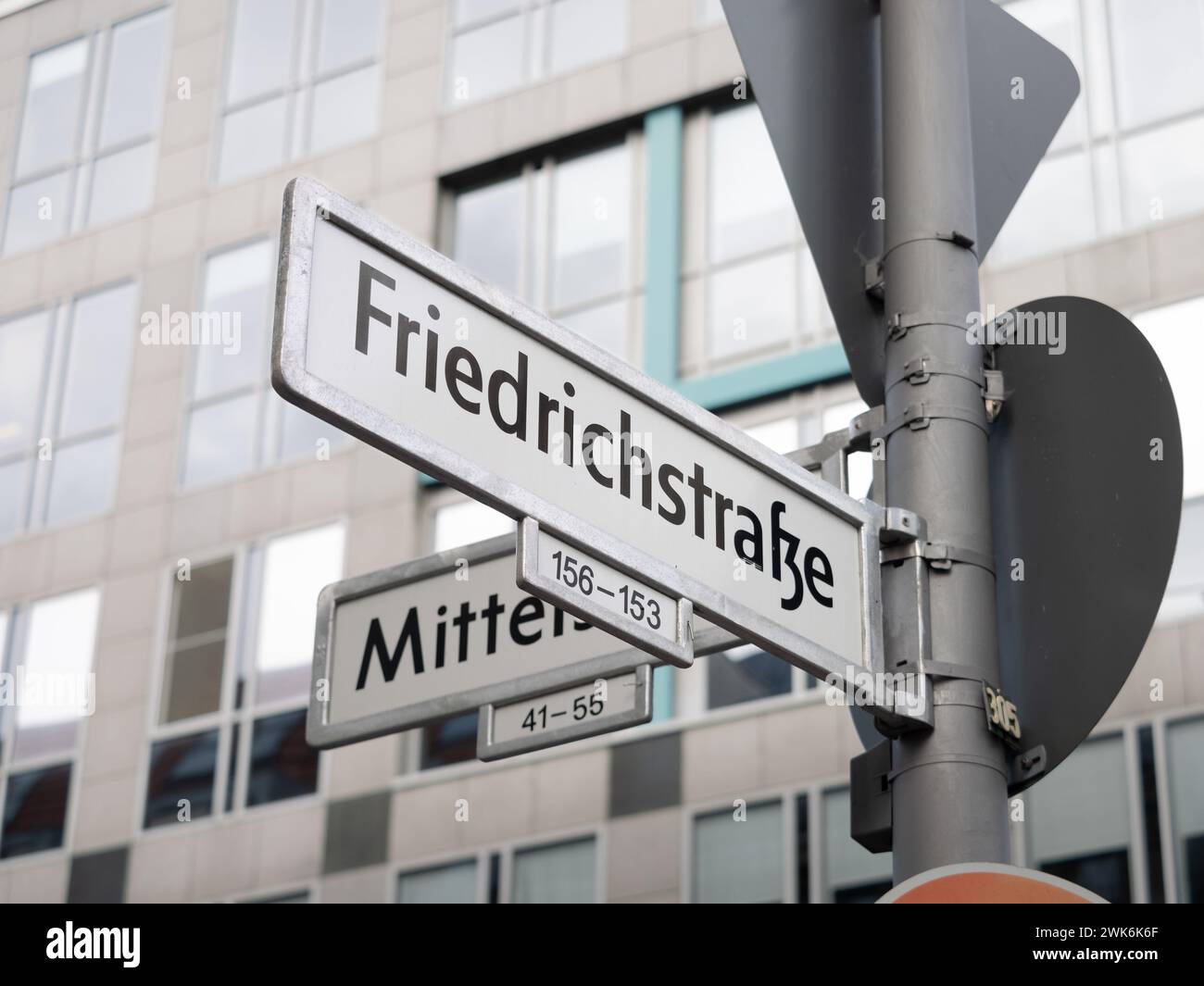 Friedrichstraße in Berlin. Sign with the road name at an intersection ...
