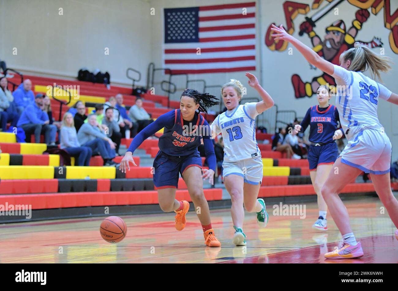 Illinois, USA. Opposing players trying to chase down a loose ball Stock ...