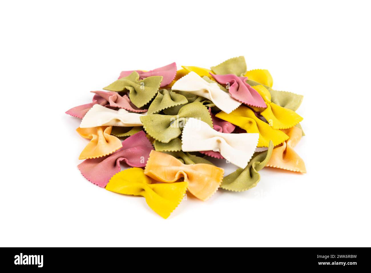 Pile of multicolored green yellow and red bowtie pasta isolated over ...
