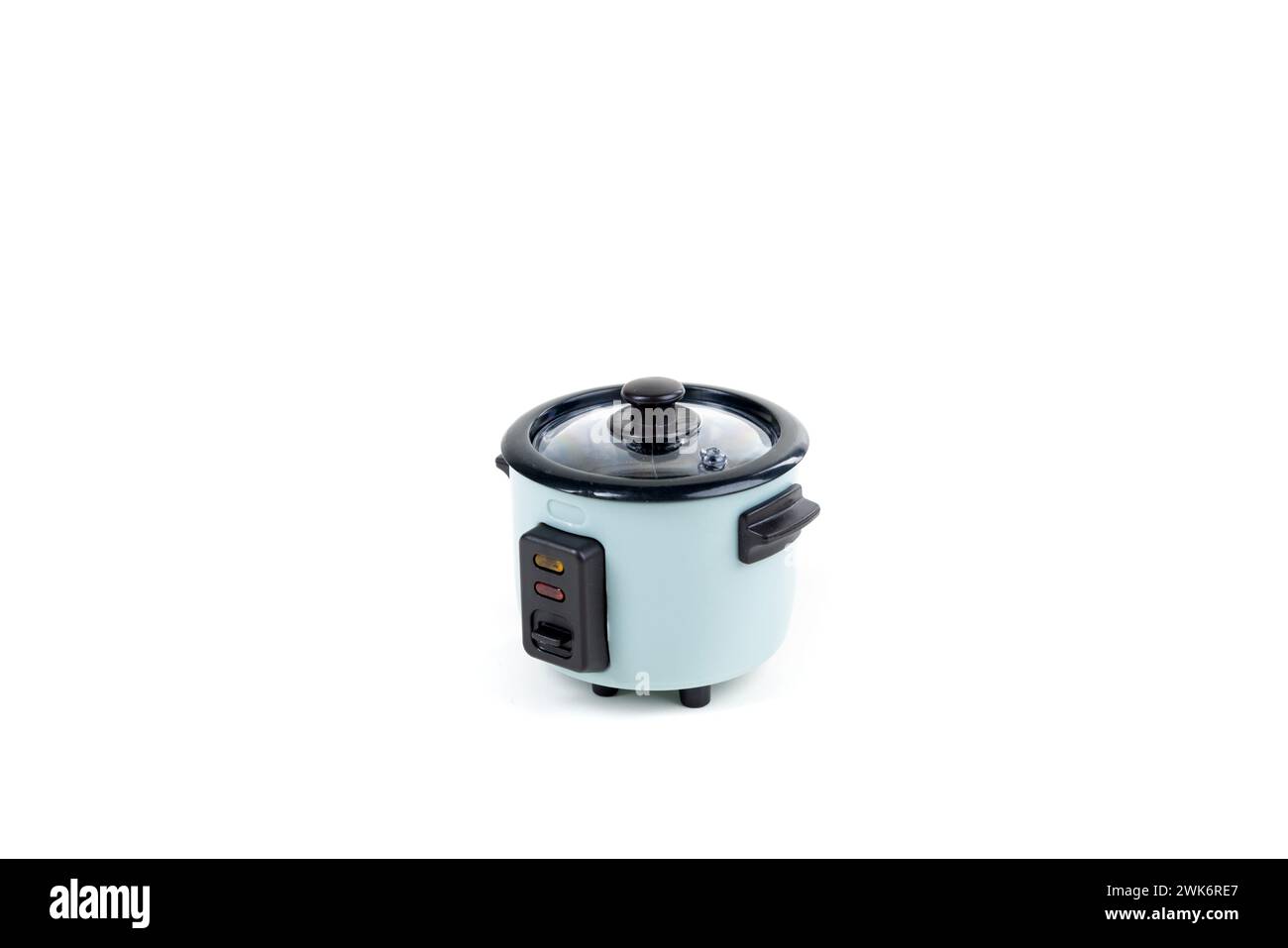 Tiny blue toy rice cooker with lid isolated over white side view Stock ...