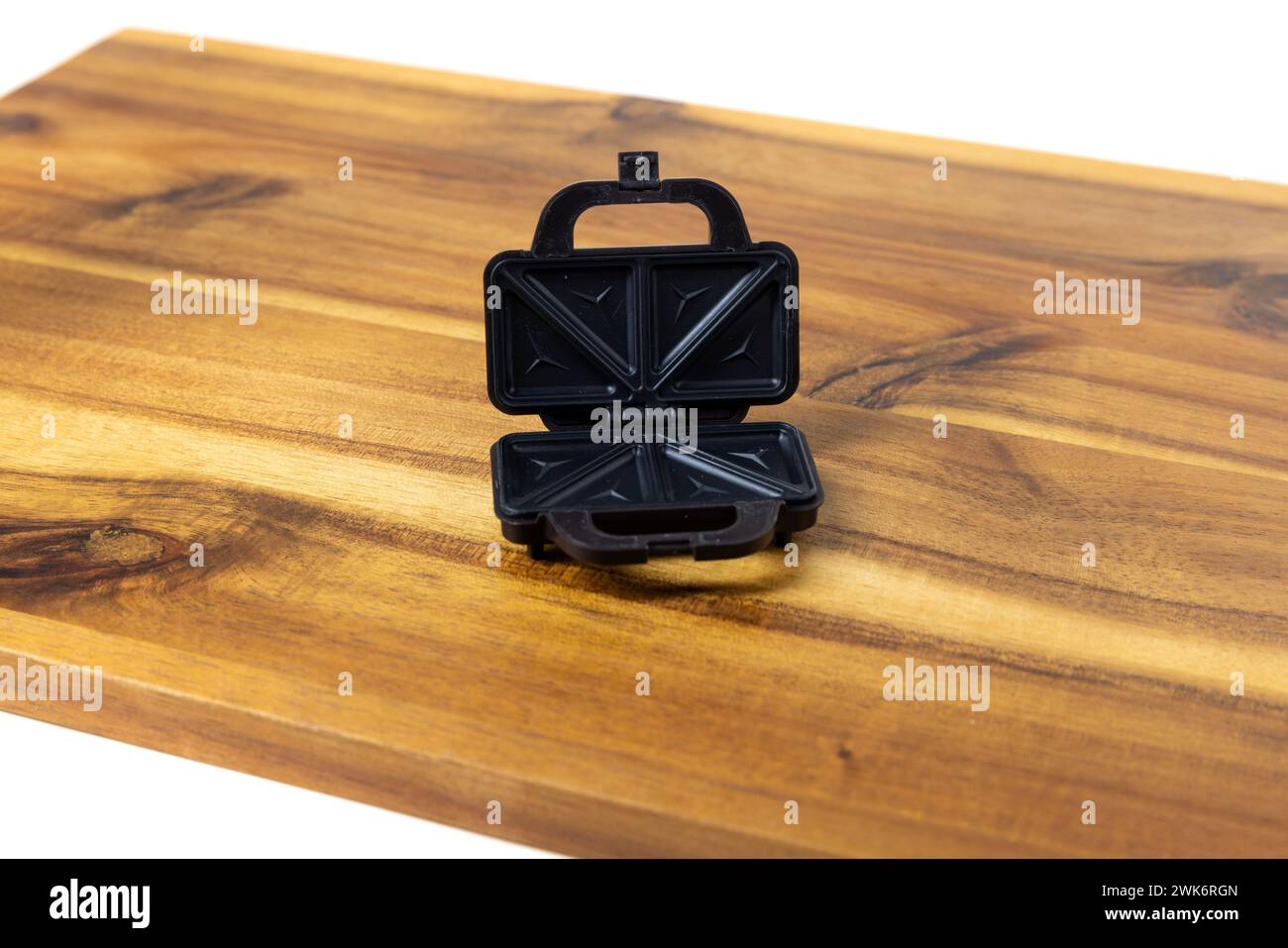 Tiny doll sized sandwich toaster on a wood cutting board Stock Photo ...
