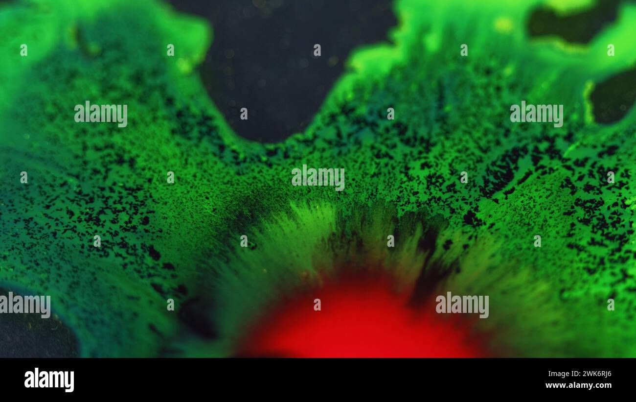 Paint drop ink spill red green black splash flow Stock Photo - Alamy