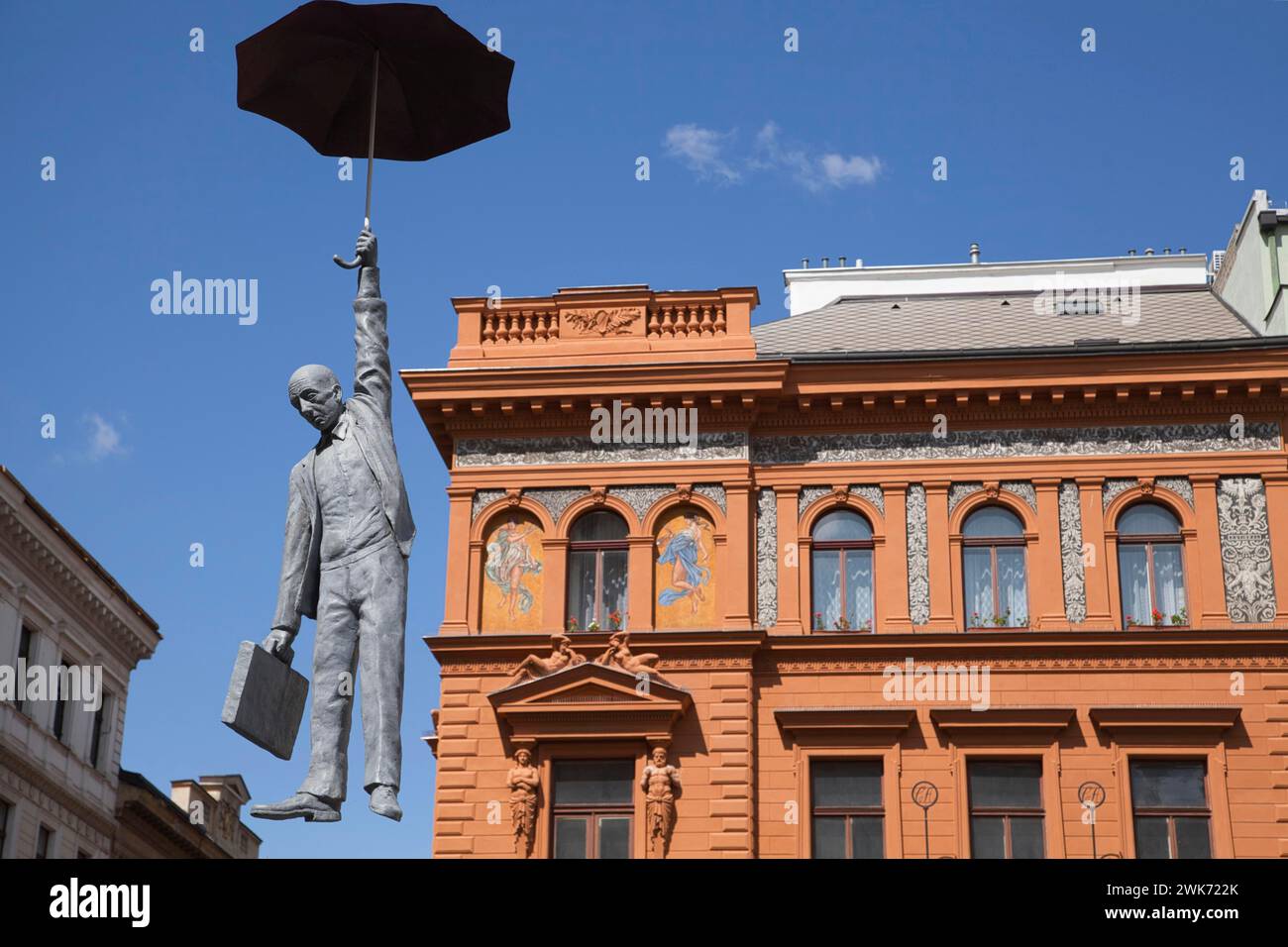 Man jumping with umbrella, art object in Prague, Czech Republic Stock ...