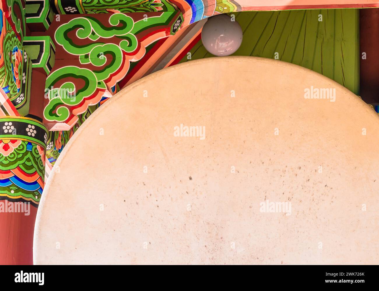 Face of an oriental ceremonial drum at a colorful Buddhist temple in ...