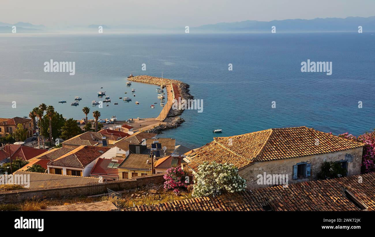 Coastal town view with harbour scenery, boats and traditional roofs ...