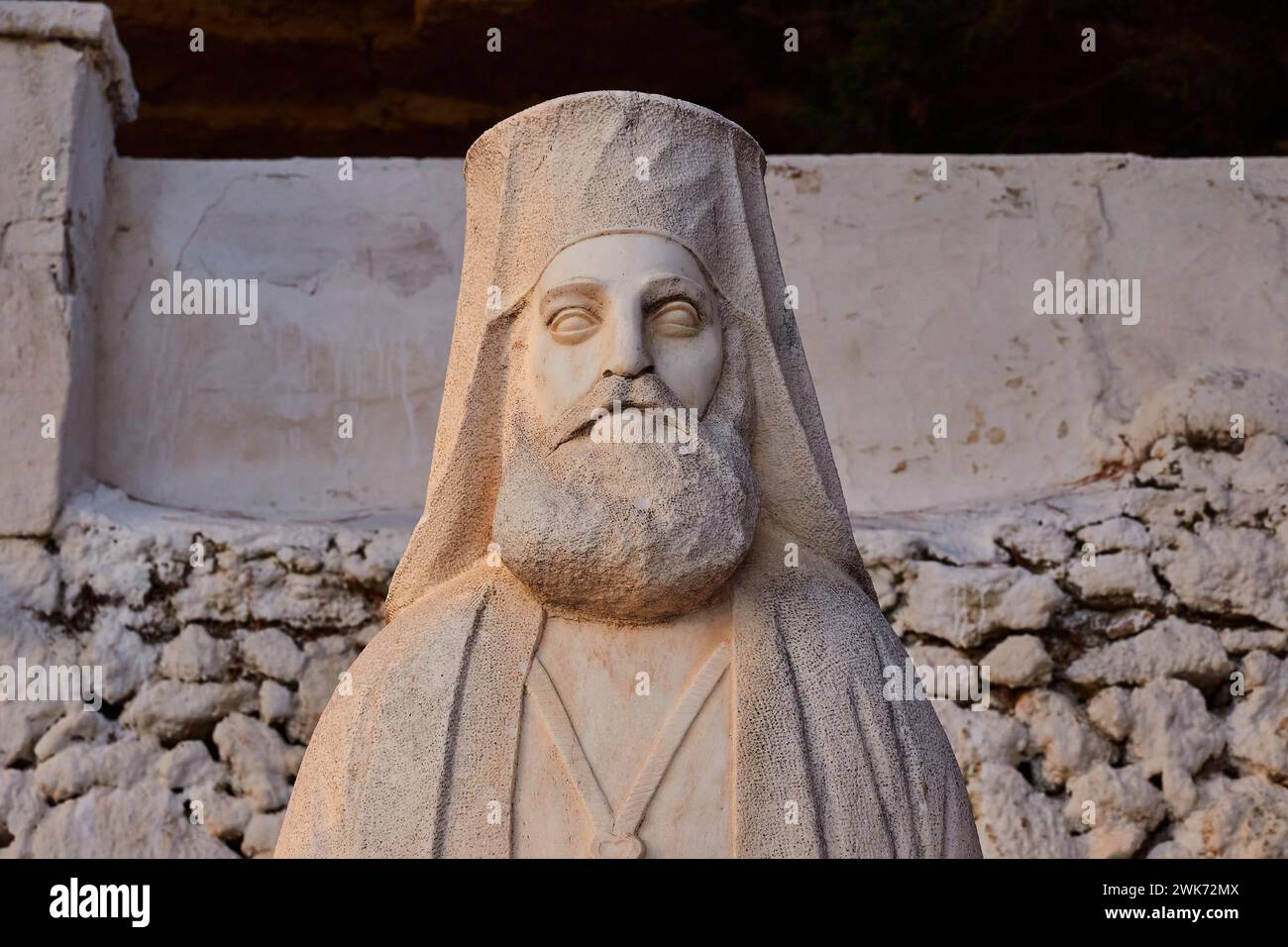 A stone statue of a monk with a detailed beard and seriousness, Koroni ...