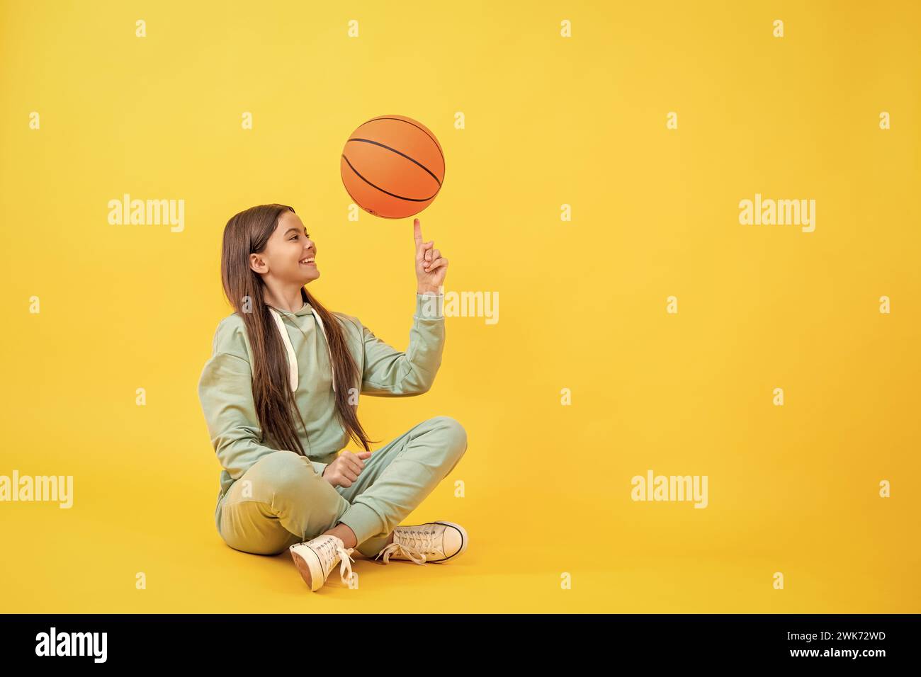 Teen girl excelling in basketball. Skilled teen girl playing the ...