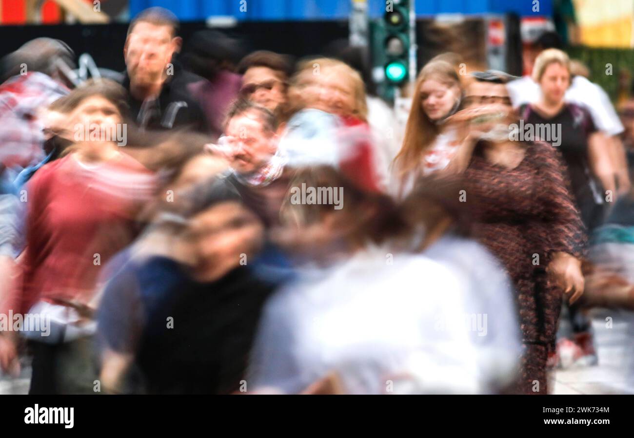 Dense crowds around Alexanderplatz. People with masks. Difficult to ...