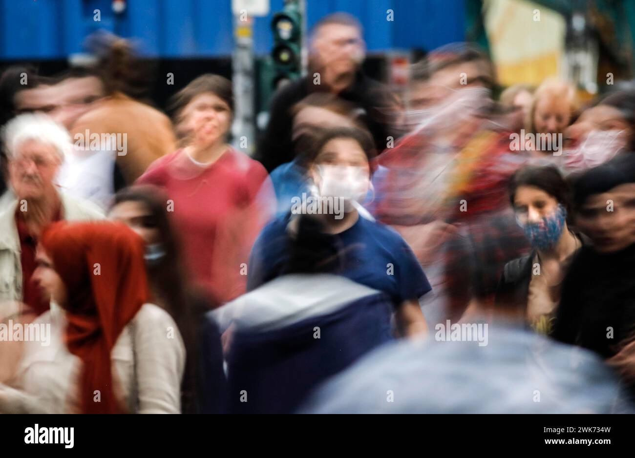 Dense crowds around Alexanderplatz. People with masks. Difficult to ...