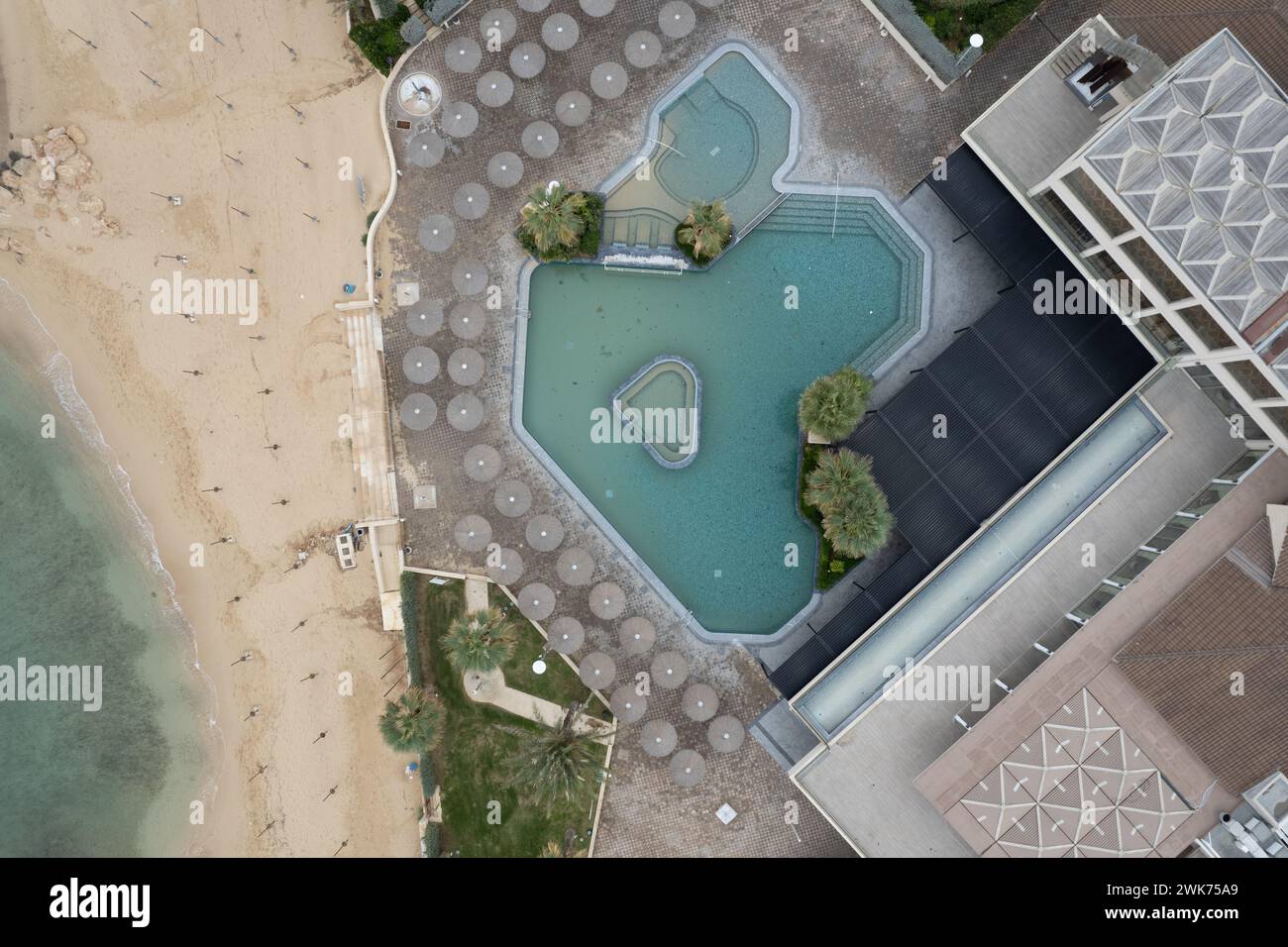Drone aerial of empty abandoned deserted swimming pool. Dirty water ...