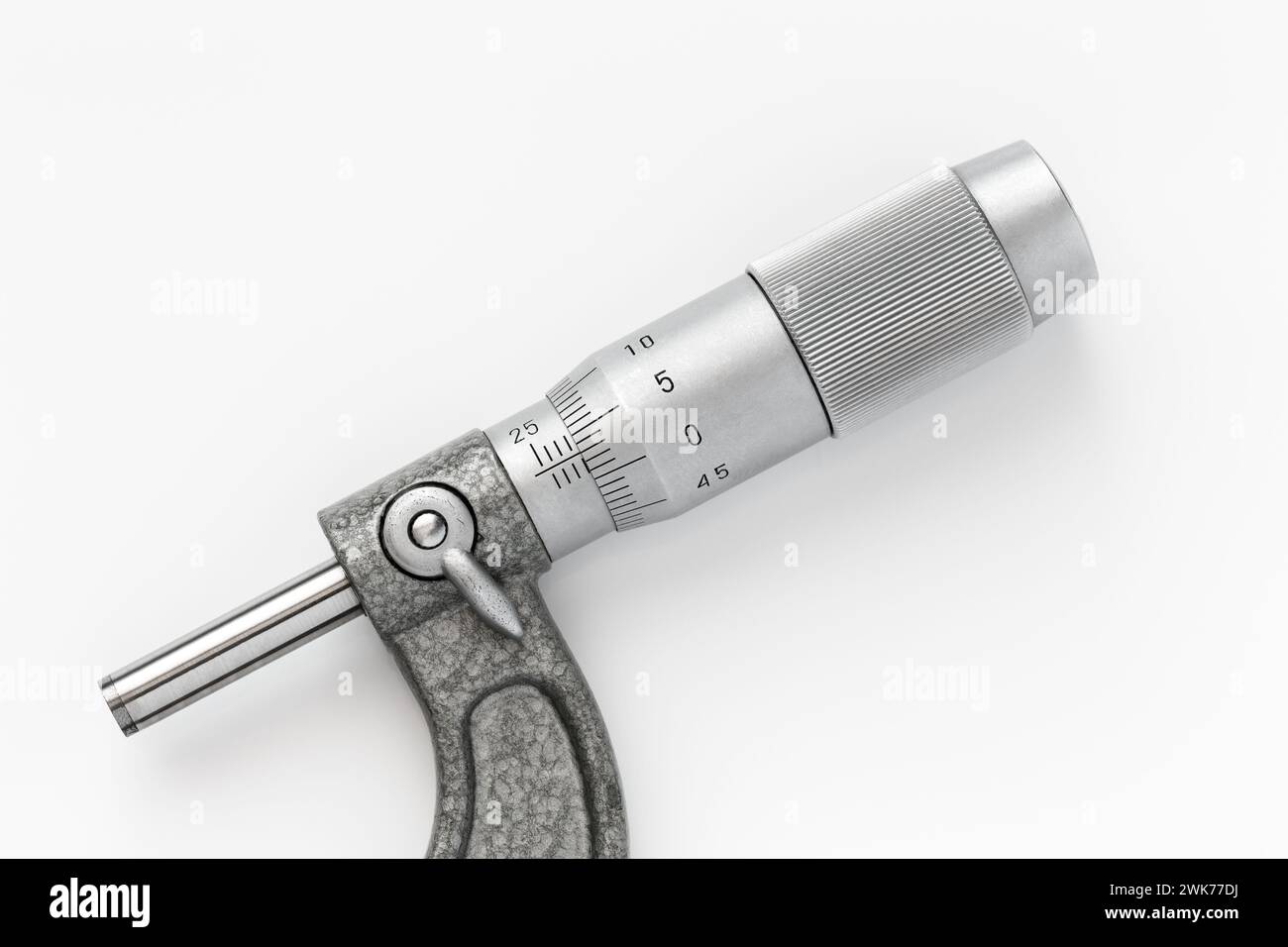 Fragment of a precision micrometer with a vernier scale on a white ...