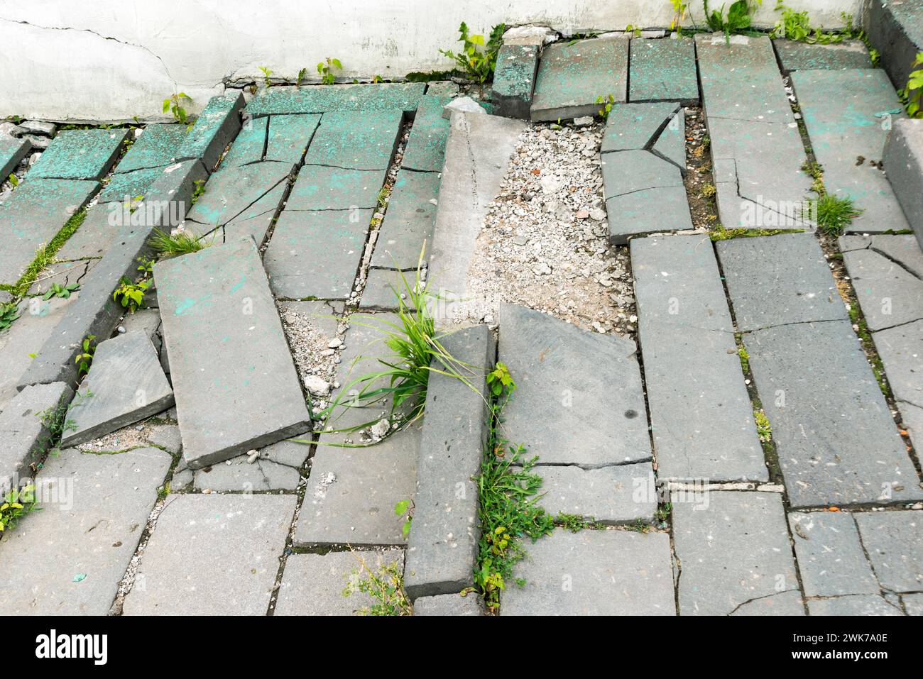 fragment of damaged city pavement with broken tile blocks Stock Photo ...