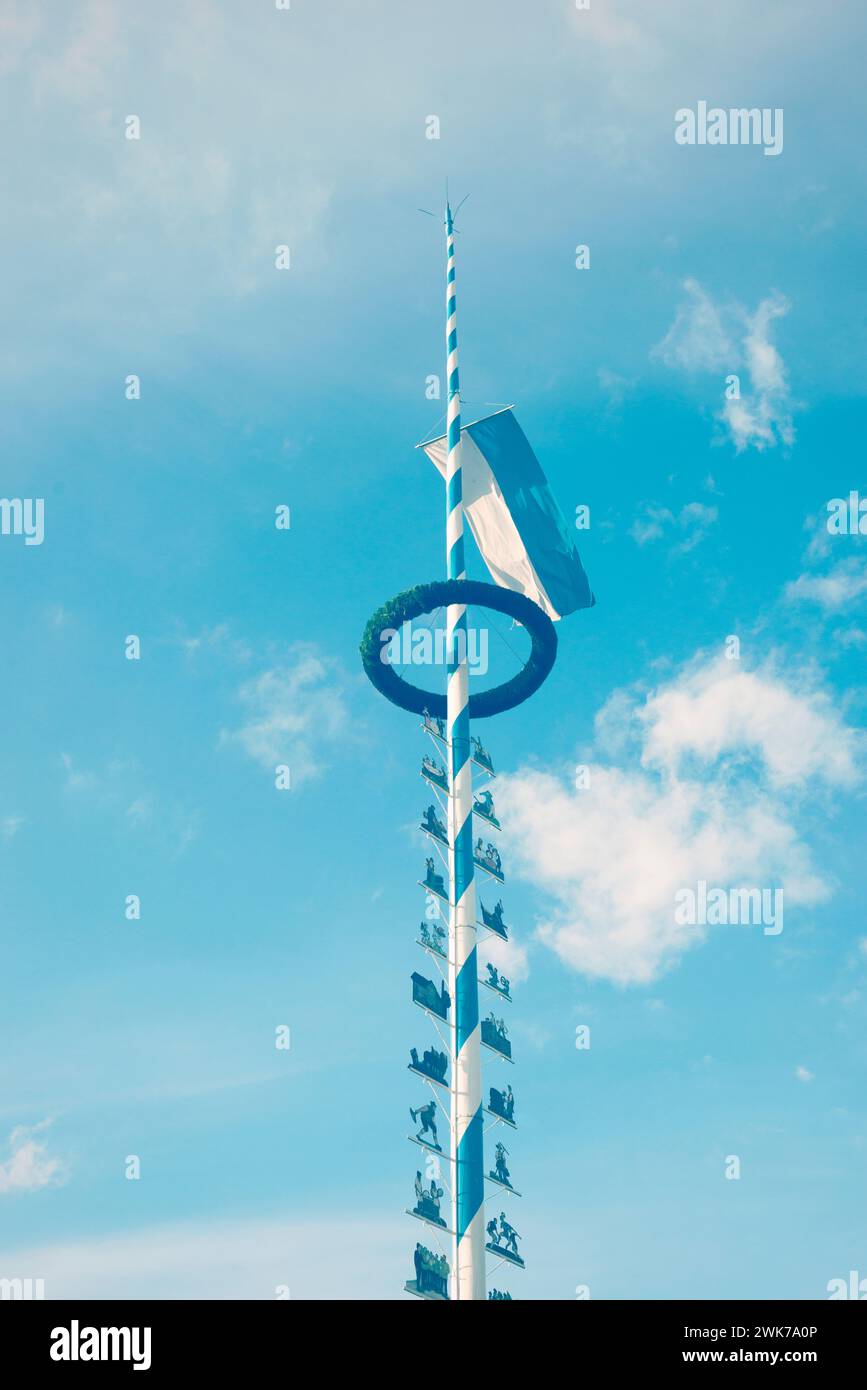 traditional Bavarian maypole and flag over blue sky background Stock ...