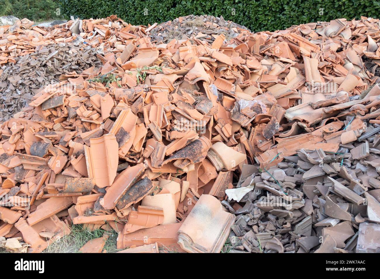 Old roof tile pile of broken roofing tiles on the street after a ...