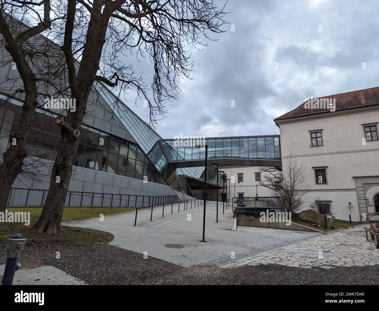 A path between a tall building and trees: Linz, Austria Stock Photo - Alamy