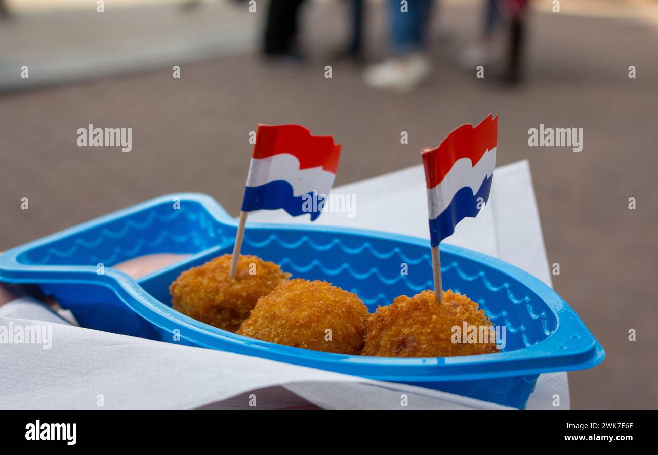 Traditional dutch street food decorated with holland flags. Fried fish ...