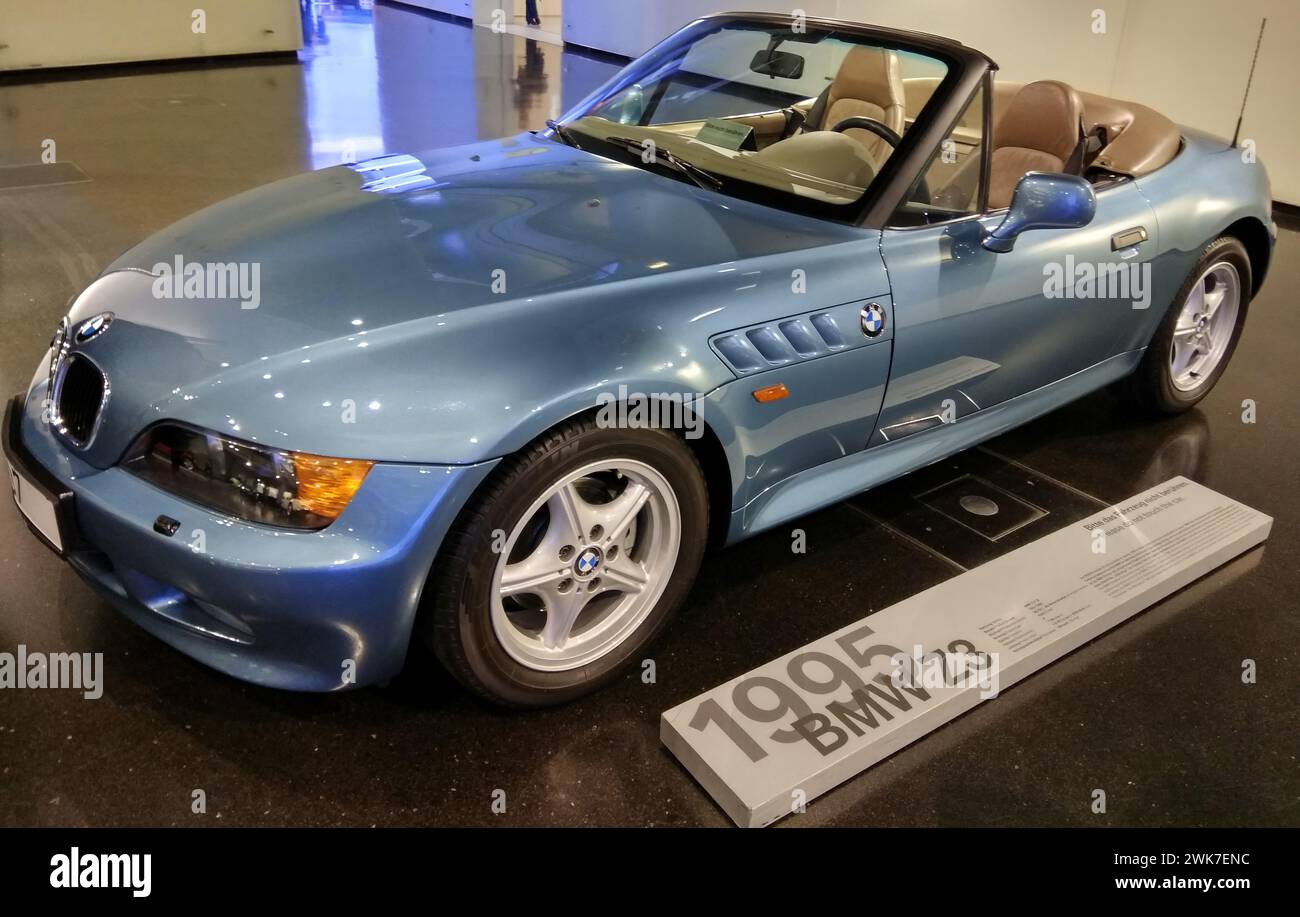 Blue convertible car with top open and driver seat reclined Stock Photo ...