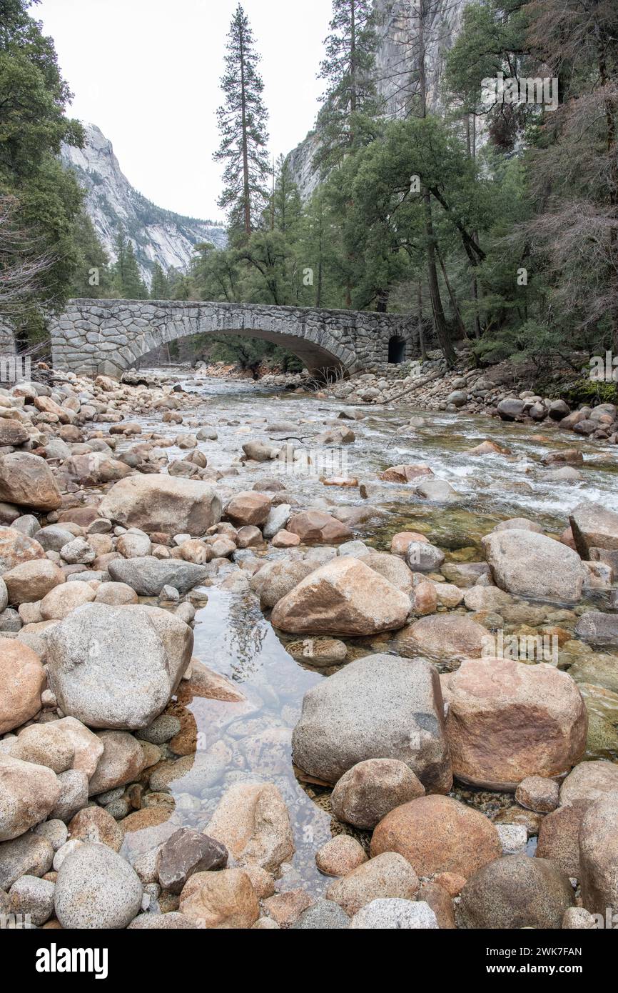 The old stone Happy Isles bridge over the Merced river in Yosemite National park in the Sierra ...