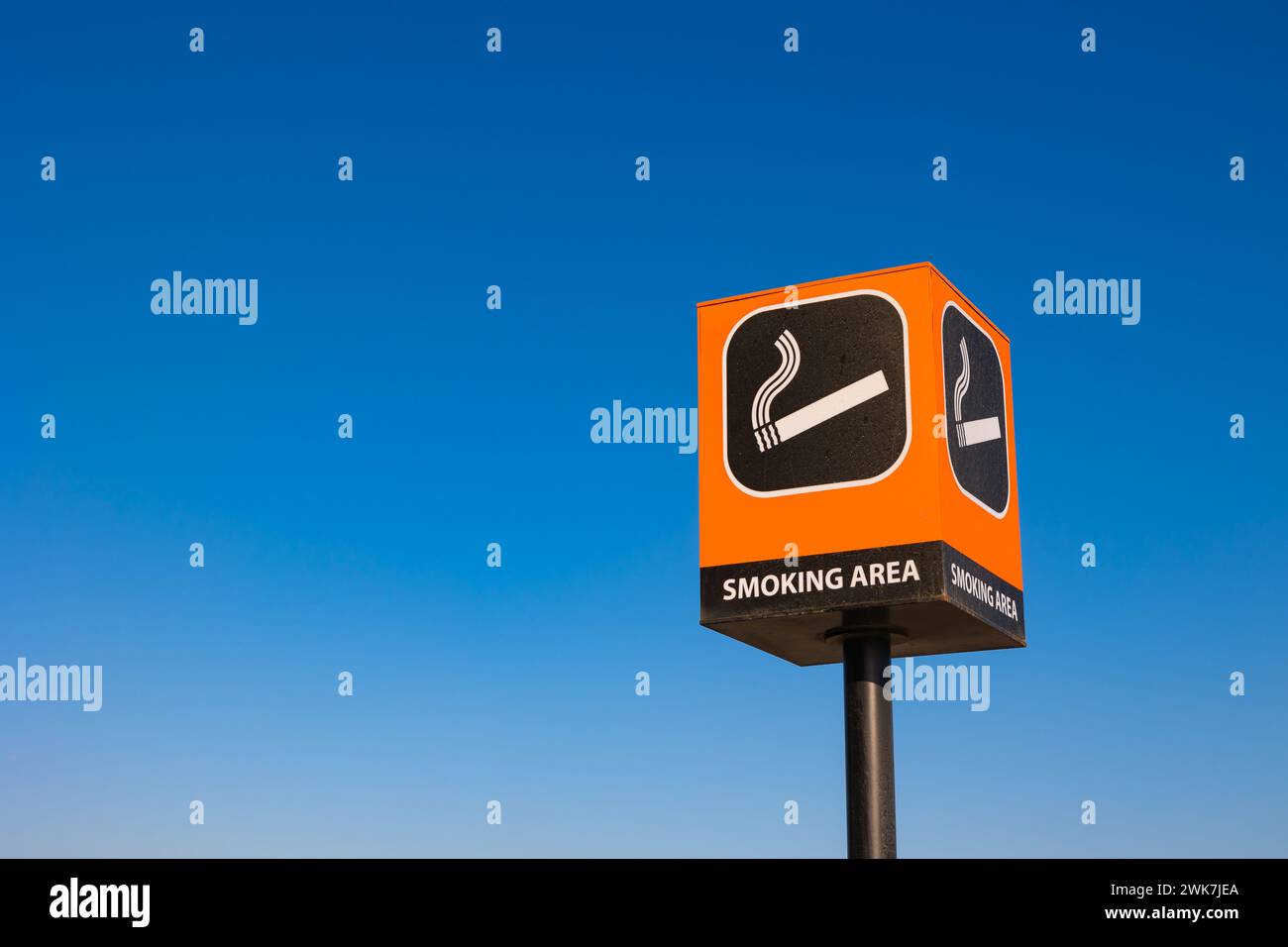 Smoking area signpost isolated on blue sky background. Permitted ...