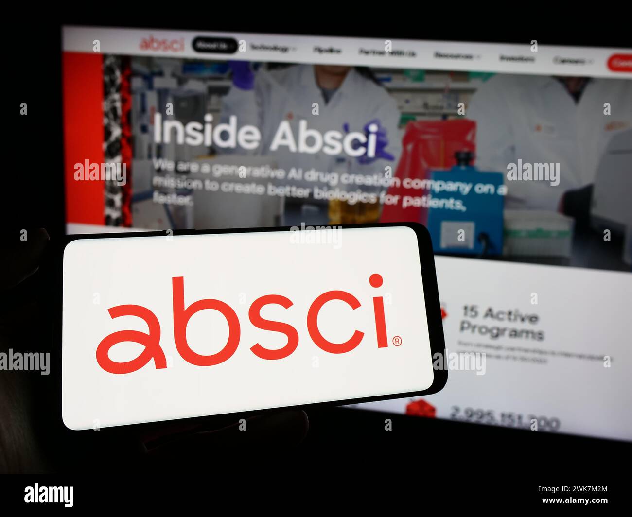 Person holding mobile phone with logo of American drug discovery ...