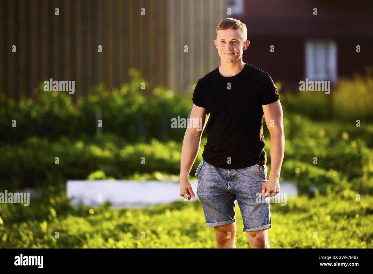 Horizontal knee length portrait of white man in her 20s, Caucasian male ...