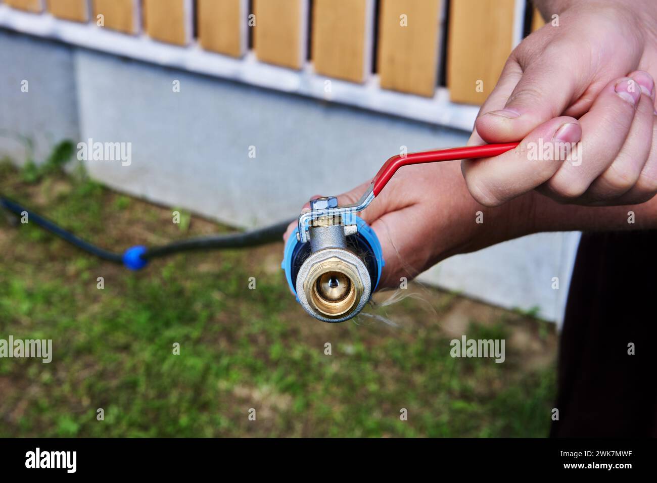 Brass ball valve with an activation lever is connected to PE pipe using ...