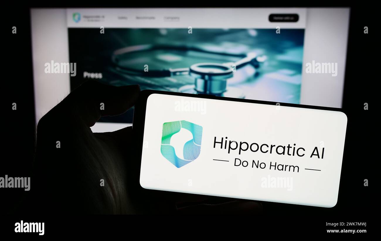 Person holding mobile phone with logo of American company HealthGPT Inc ...