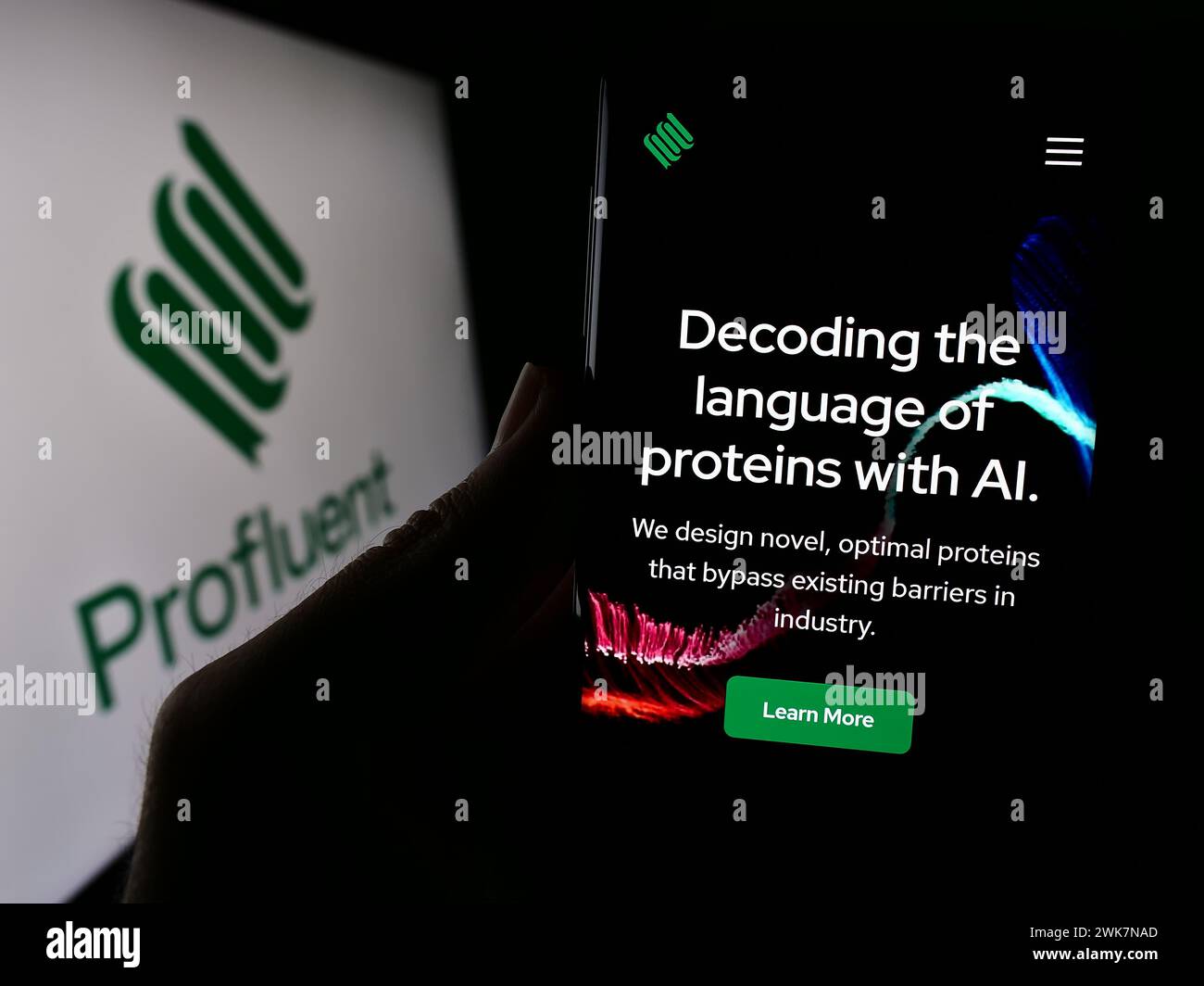 Person holding cellphone with webpage of US biotechnology company Profluent Bio in front of ...