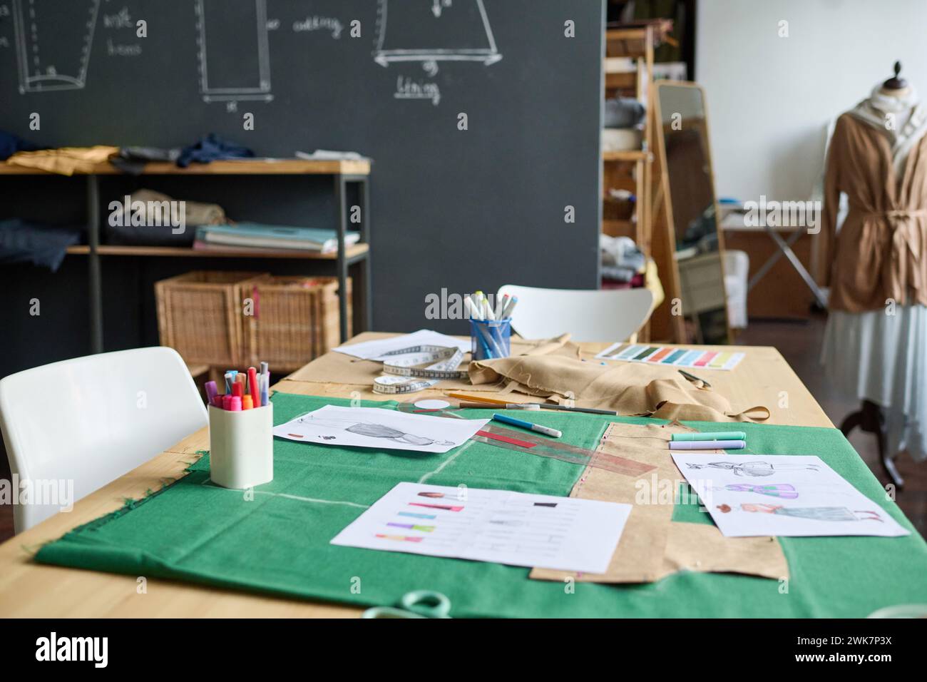 Background image of atelier workshop interior with sewing patterns on ...