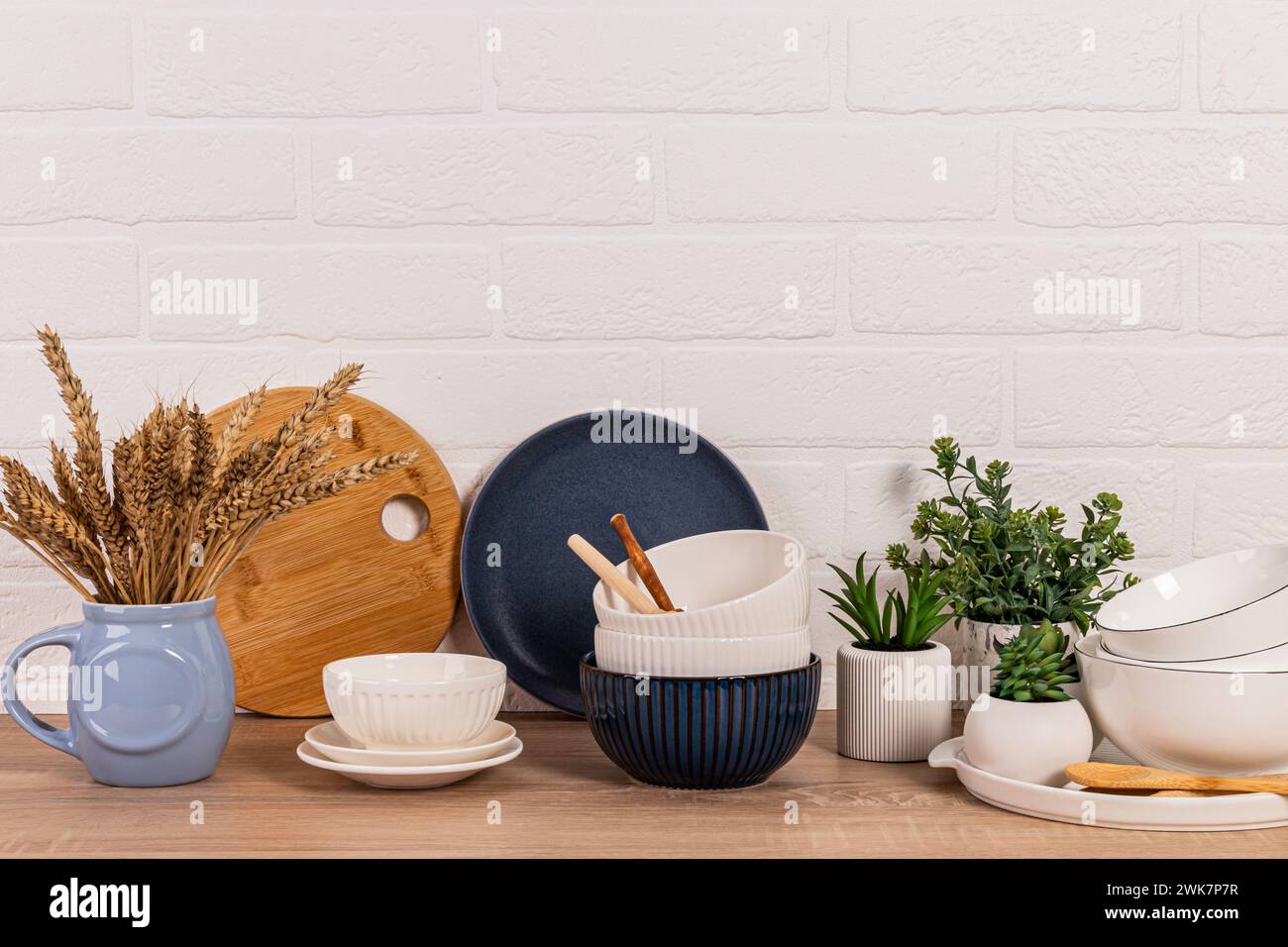 Beautiful kitchen background with different ceramic bowls,potted indoor ...