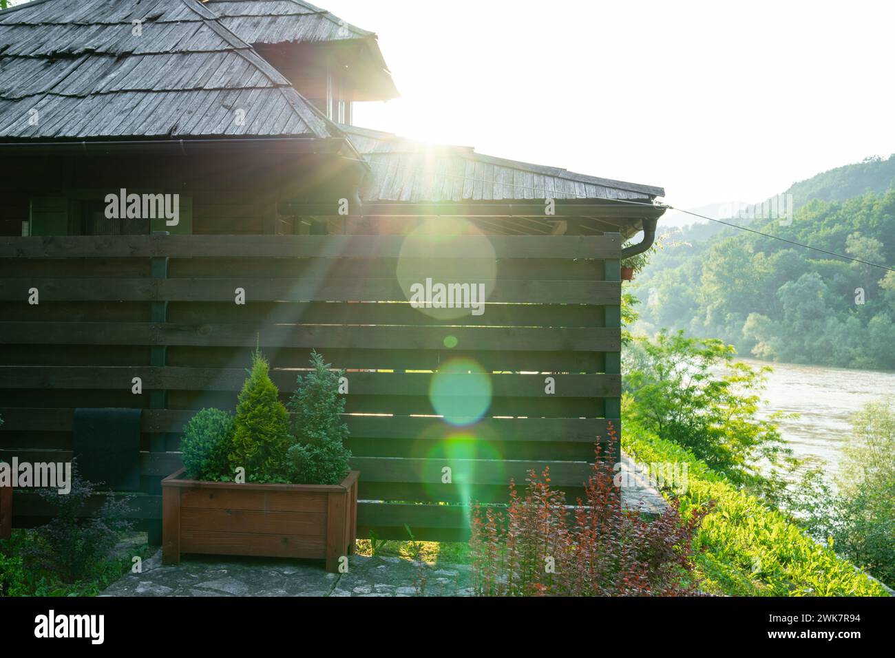 Porch of a wooden house in the forest on the river bank Stock Photo - Alamy
