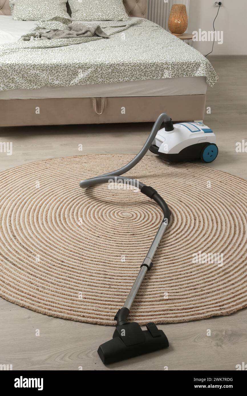 Small and simple vacuum cleaner in the apartment Stock Photo - Alamy