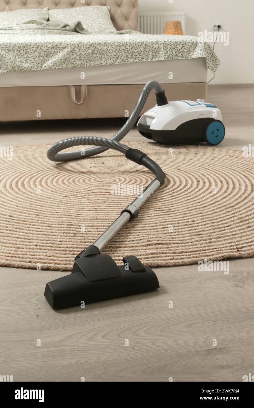 Small and simple vacuum cleaner in the apartment Stock Photo - Alamy