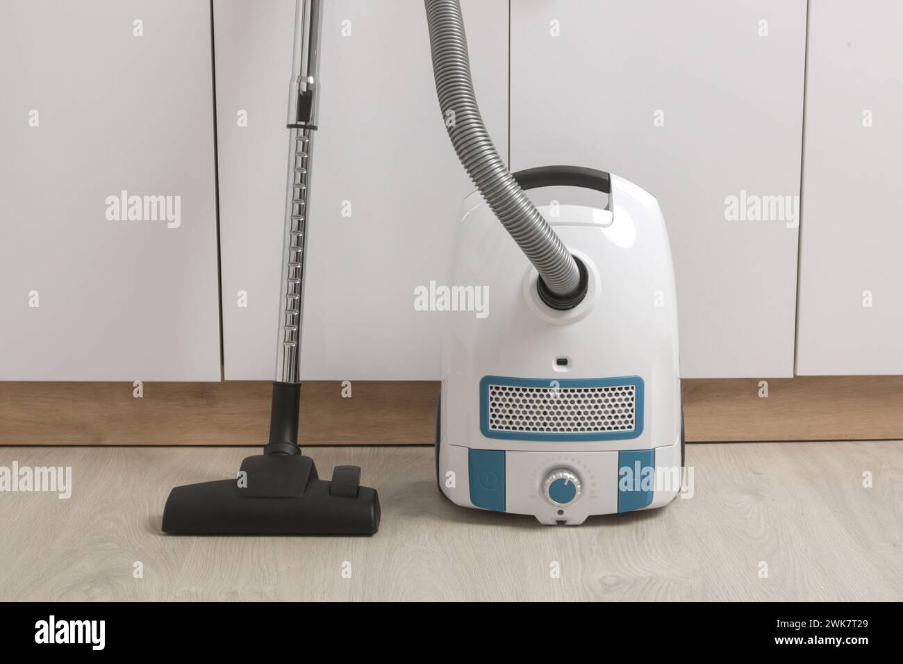 Small and simple vacuum cleaner in the apartment Stock Photo - Alamy