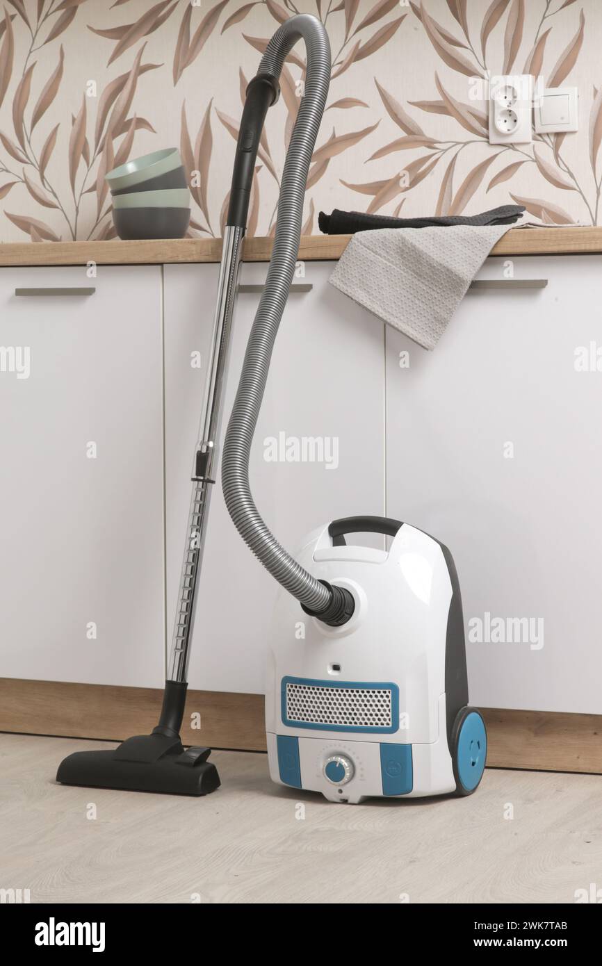 Small and simple vacuum cleaner in the apartment Stock Photo - Alamy