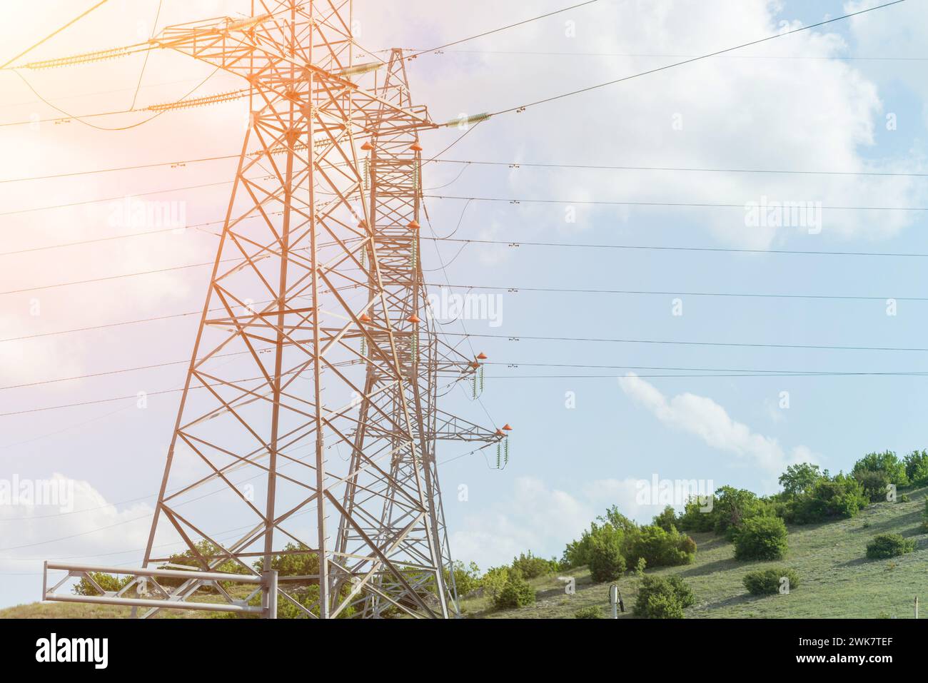 High voltage towers with sky background. Power line support with wires ...