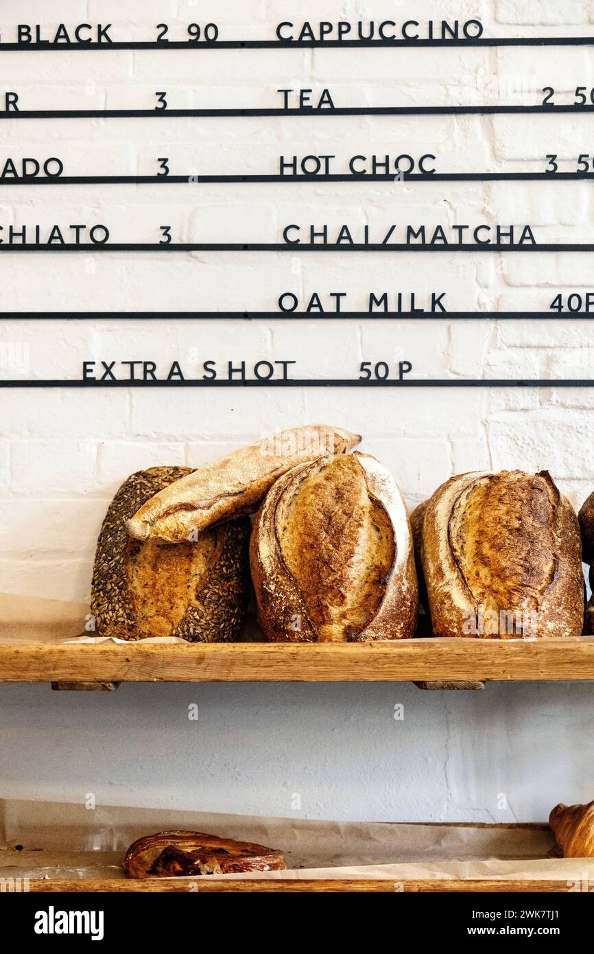 Bread on shelves and cafe menu at Back To Ours cafe and bakery ...