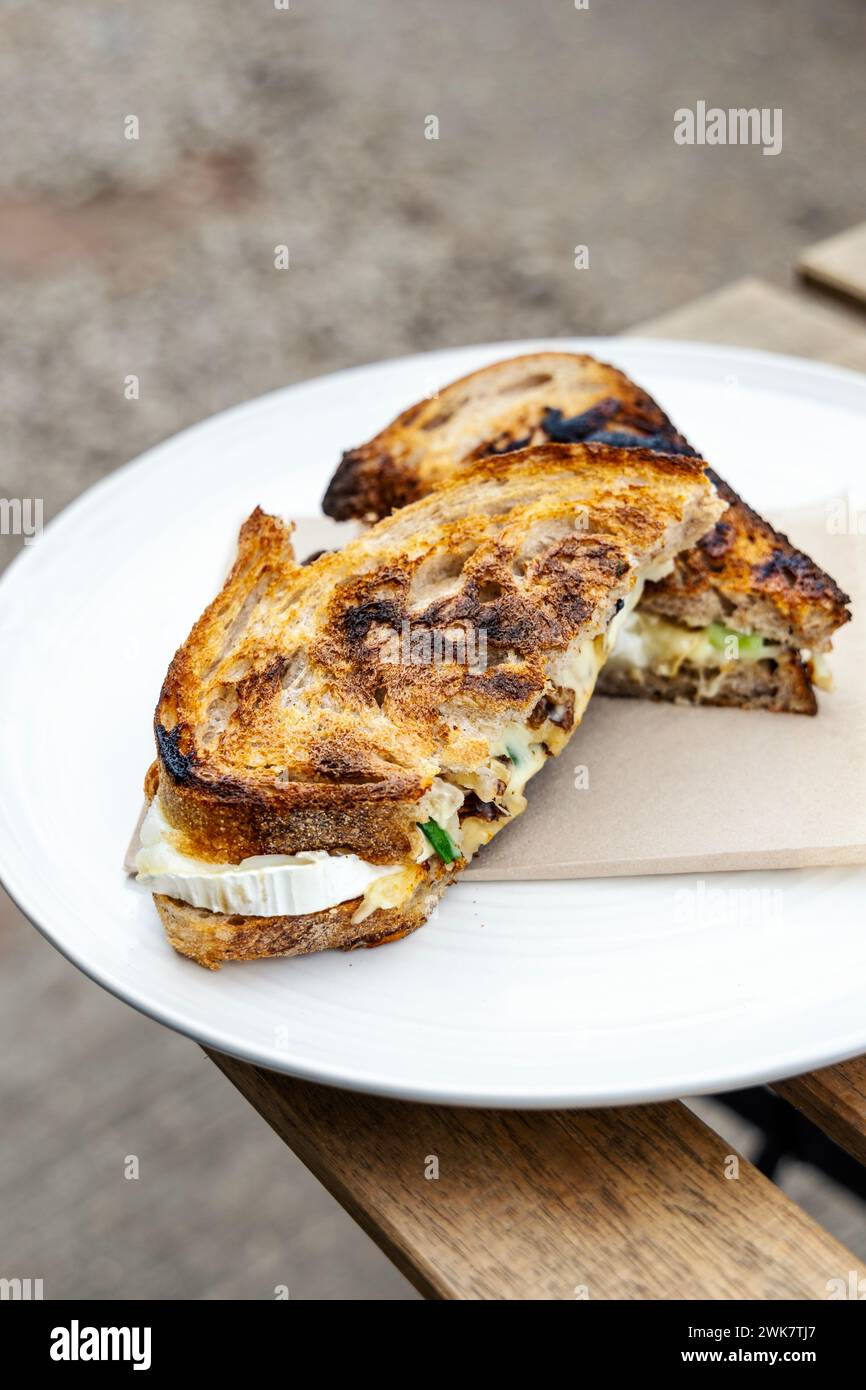 Goat cheese toastie with scallions on sourdough bread at Back To Ours ...