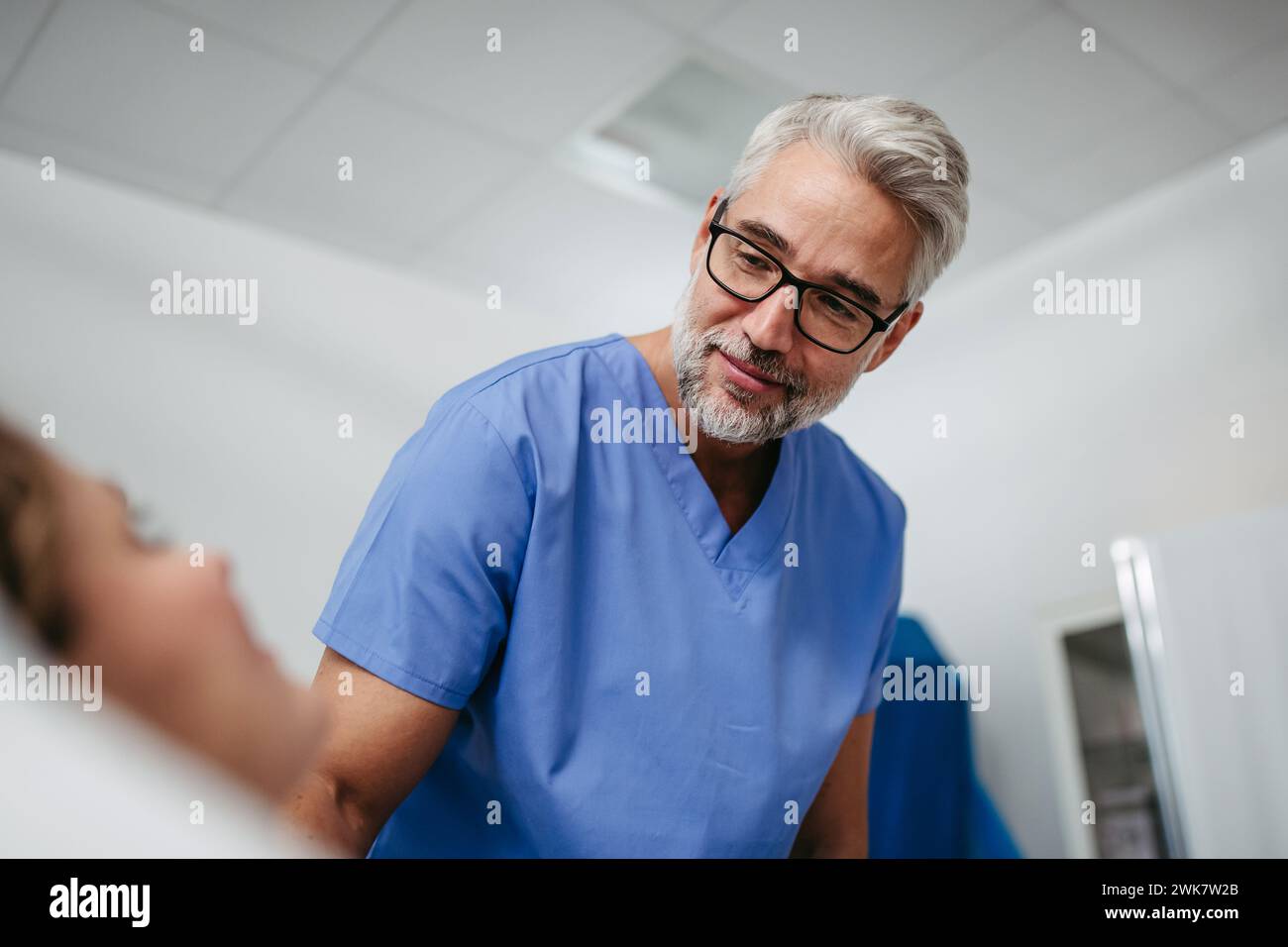 Portrait of doctor talking with worried patient, emotional support ...